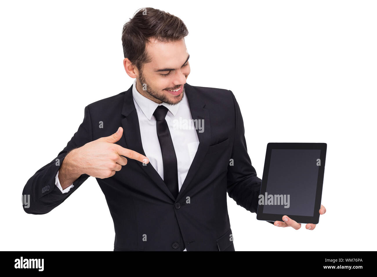Happy businessman pointing with his tablet on white background Stock ...