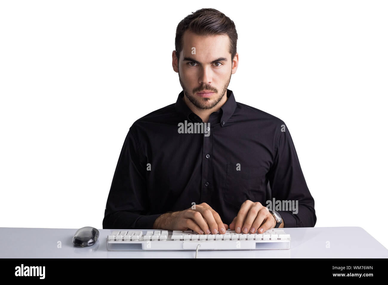 Serious businessman typing on keyboard on white background Stock Photo ...