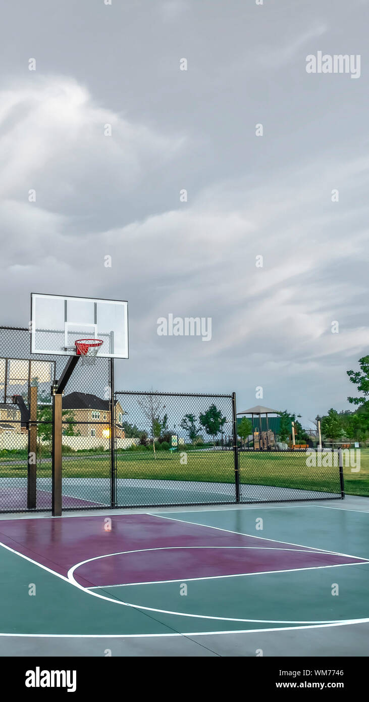 Vertical frame Basketball courts at a park near multi storey family ...