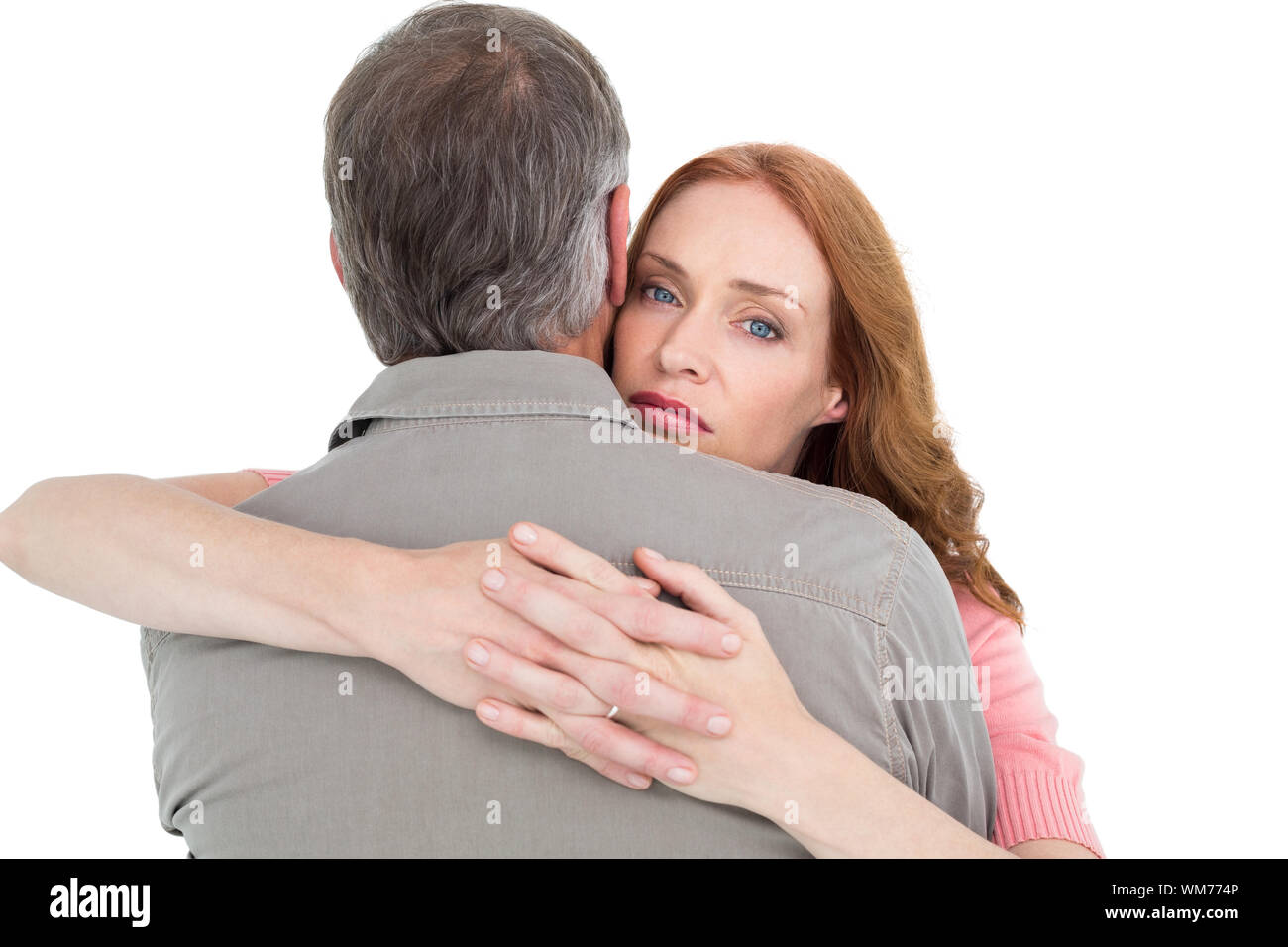 Casual couple hugging each other on white background Stock Photo - Alamy