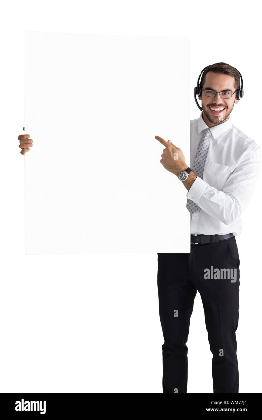 Businessman with headphone pointing sign to camera on white background ...
