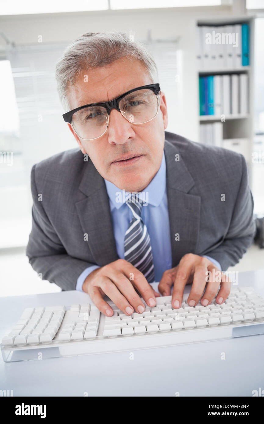 Focused businessman typing desk hi-res stock photography and images - Alamy