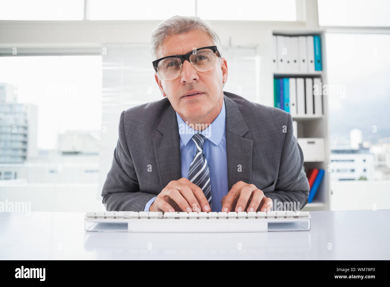 Focused man in jacket typing hi-res stock photography and images - Alamy