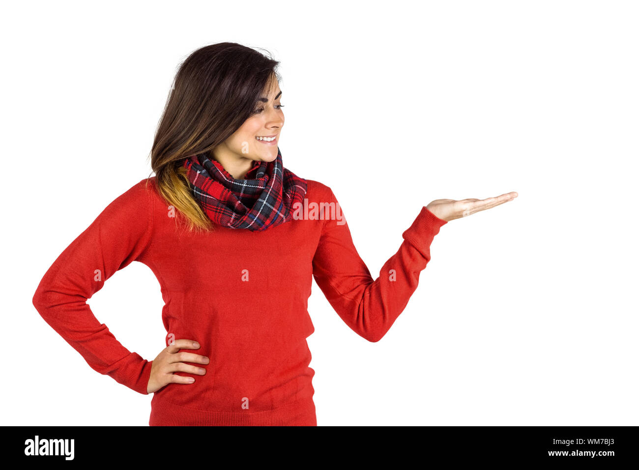 Beautiful brunette with hand out on white background Stock Photo - Alamy