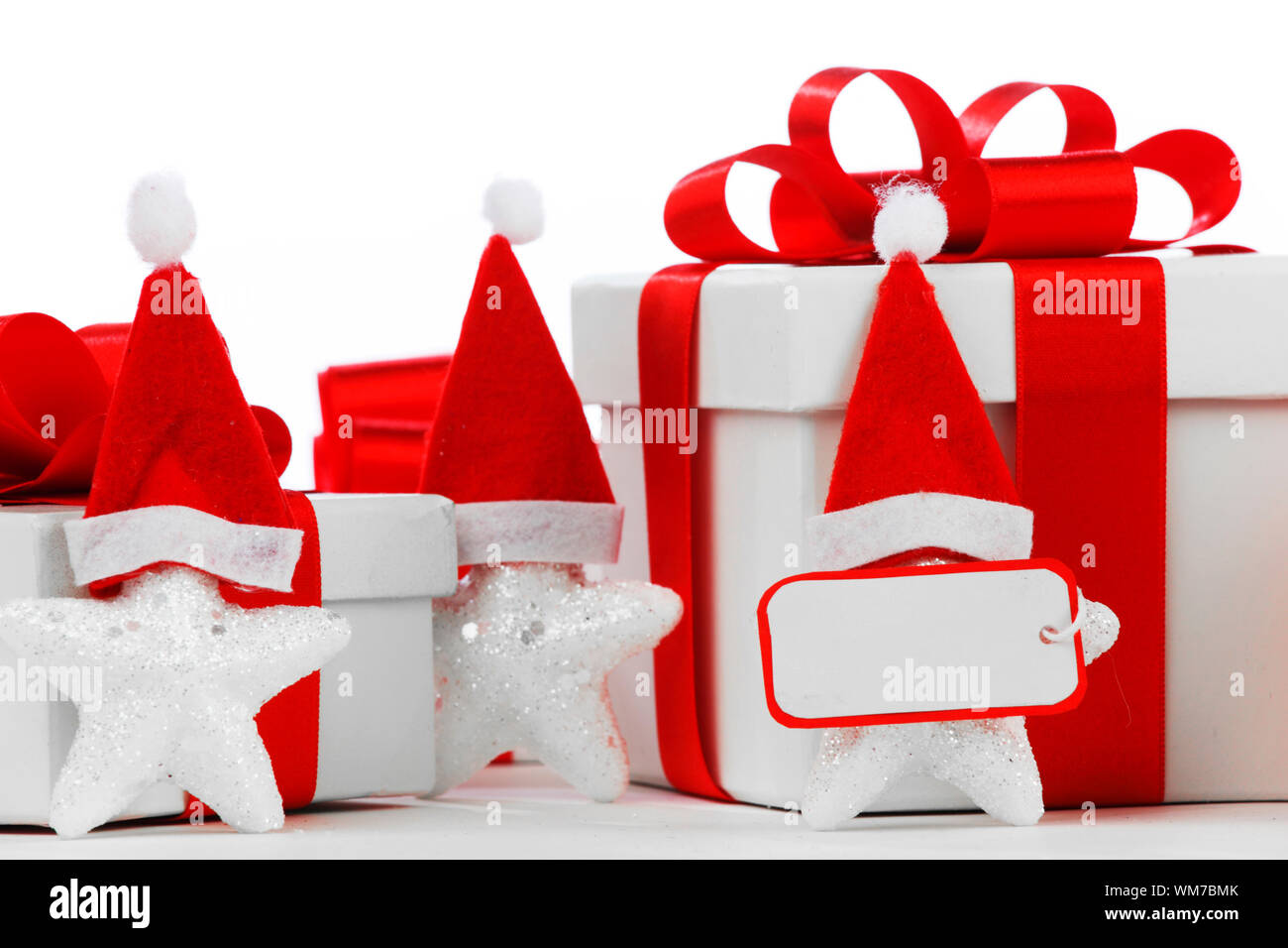 Gift boxes with santa claus stars isolated on white background Stock ...