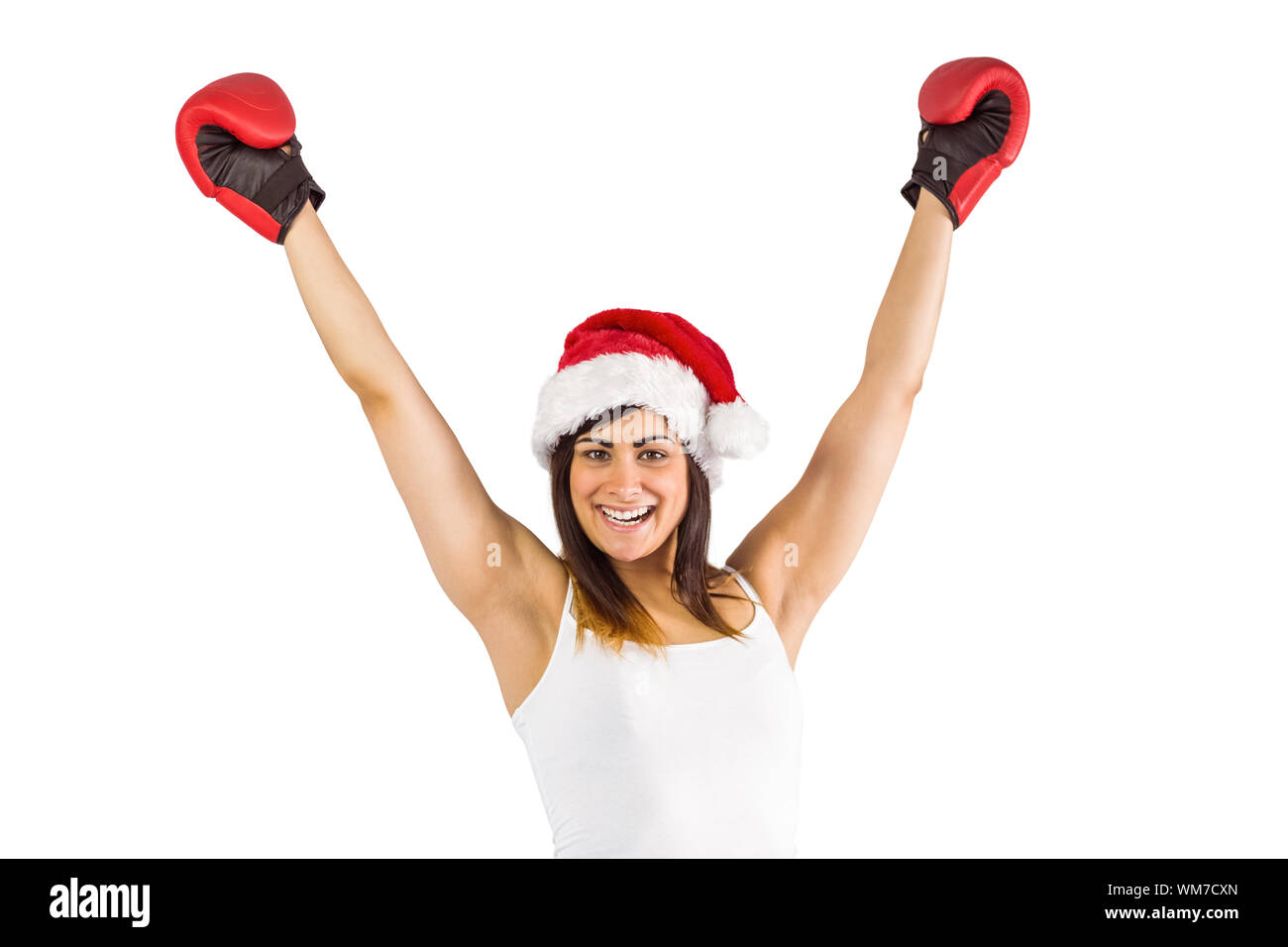 Festive brunette in boxing gloves cheering on white background Stock ...