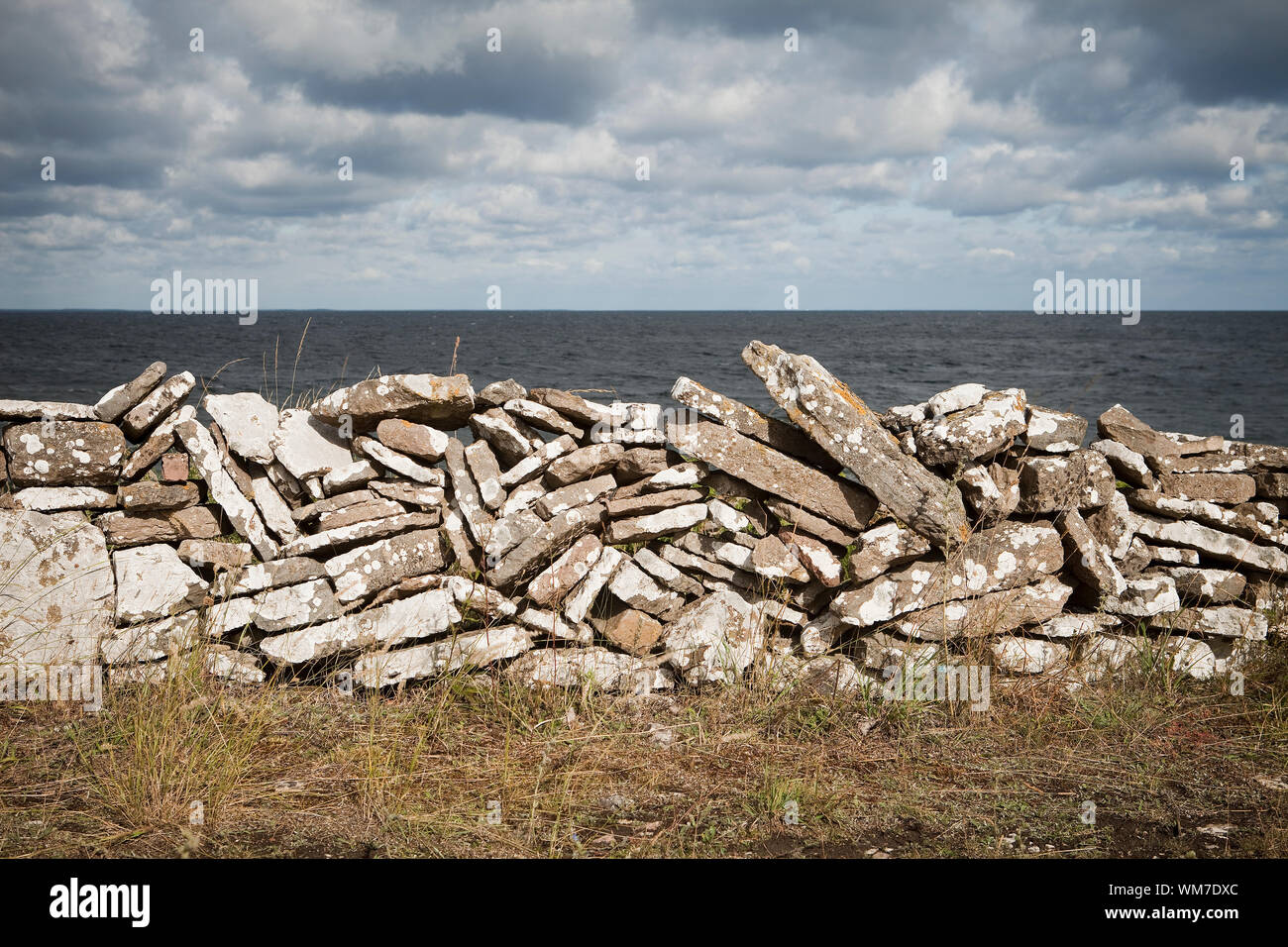 Stone wall by the ocean Stock Photo - Alamy