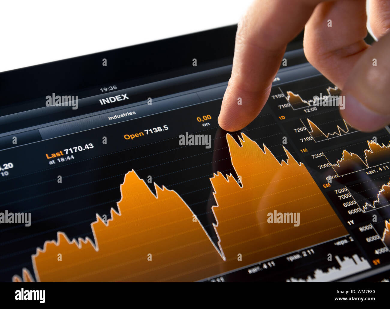 Touching stock market graph on a touch screen device Stock Photo - Alamy
