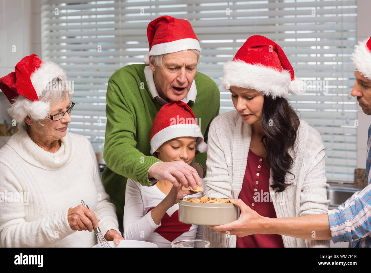 Multi-generation family baking together at home in the kitchen Stock ...
