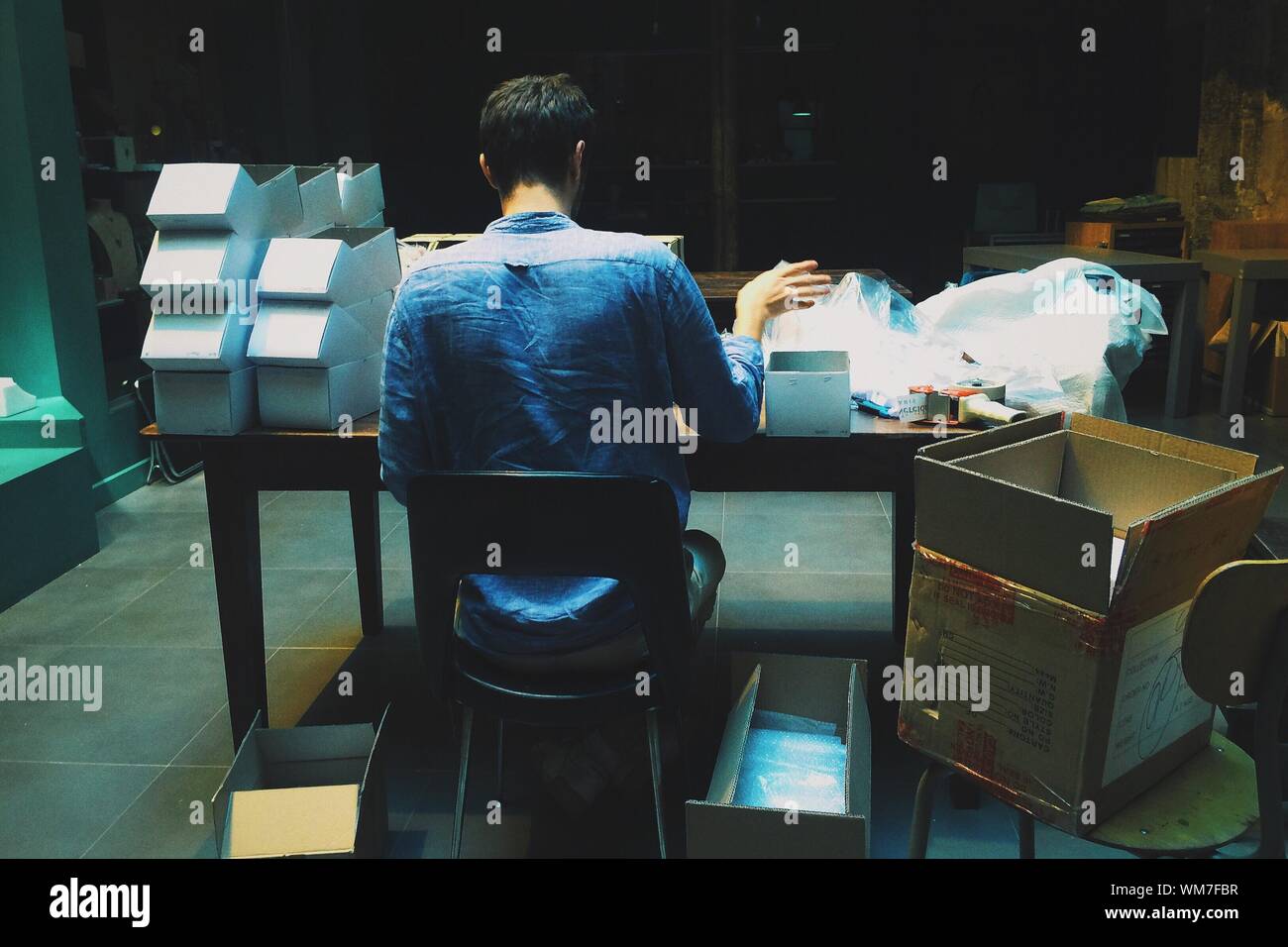 Man sitting and work desk hi-res stock photography and images - Alamy