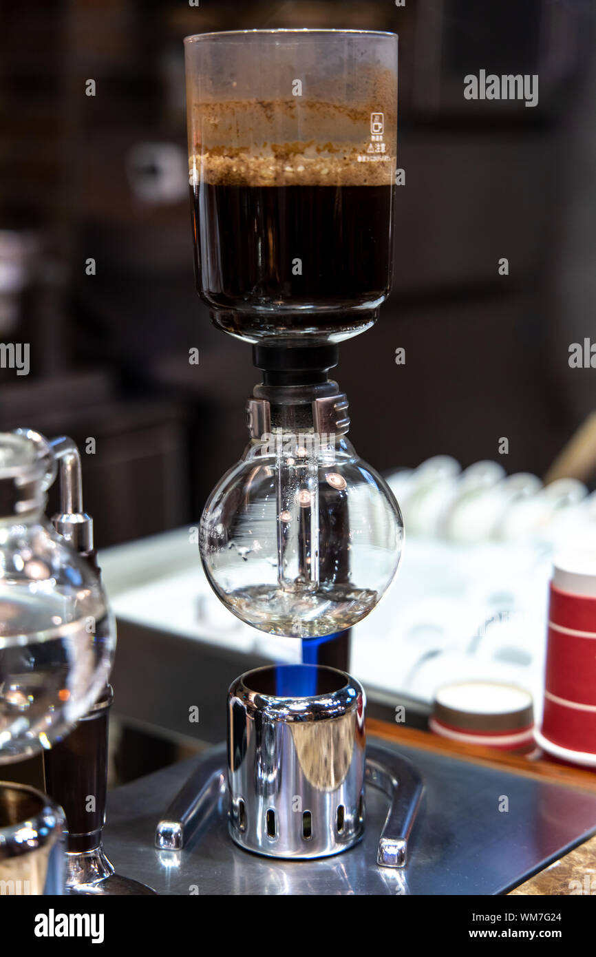 Barista doing Siphon Coffee Brewing, Manila Stock Photo - Alamy
