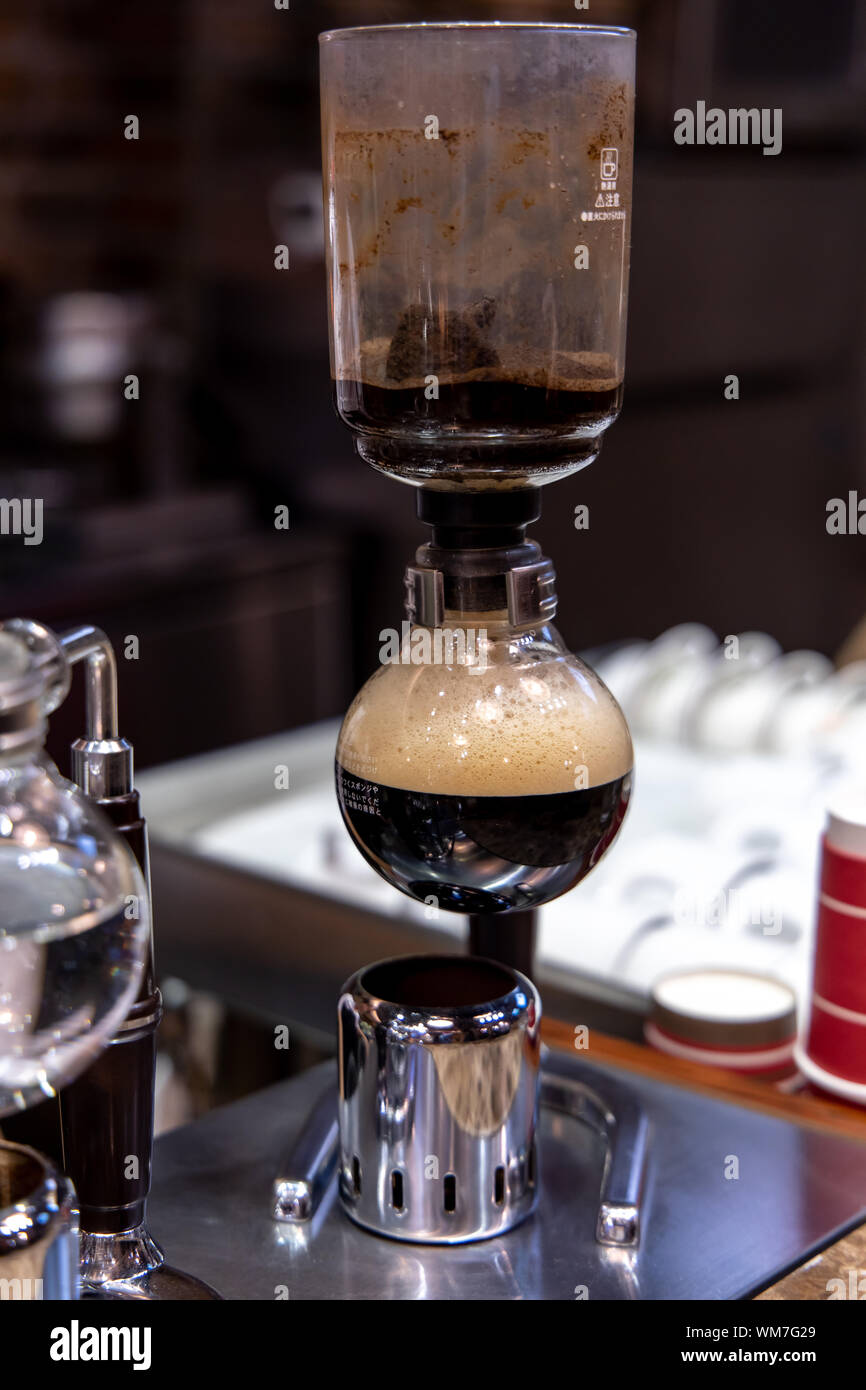Barista doing Siphon Coffee Brewing, Manila Stock Photo - Alamy
