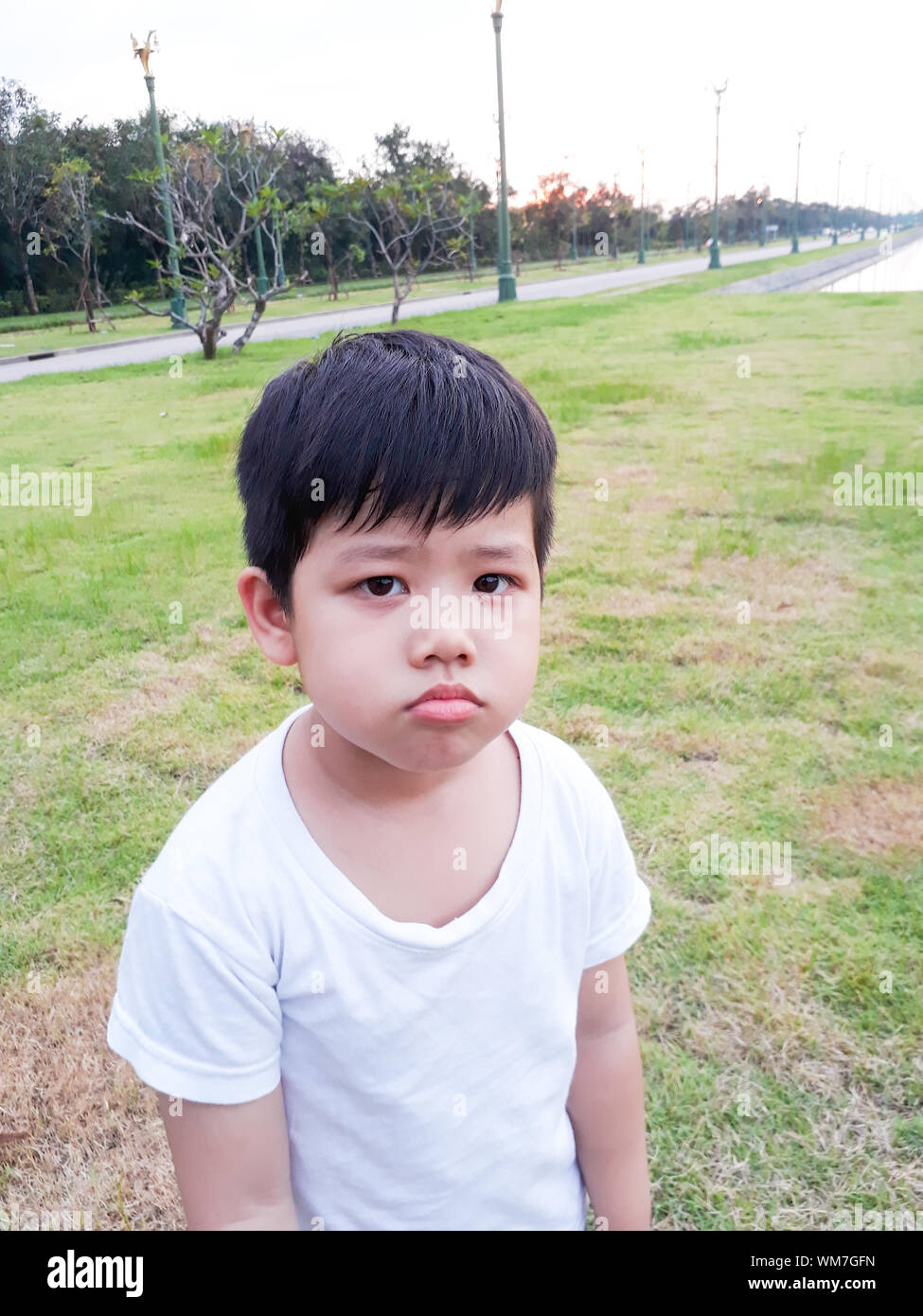 Boy standing sad hi-res stock photography and images - Alamy