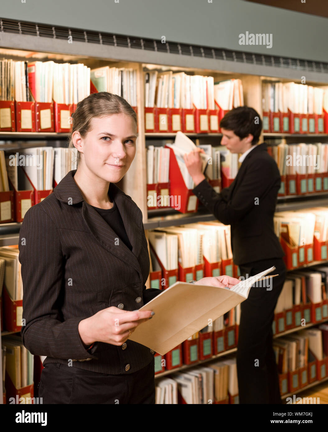 Two women at a library Stock Photo - Alamy