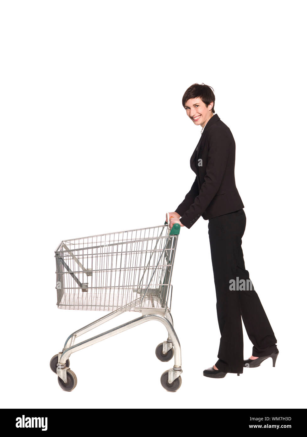 Woman with an empty shopping cart Stock Photo - Alamy