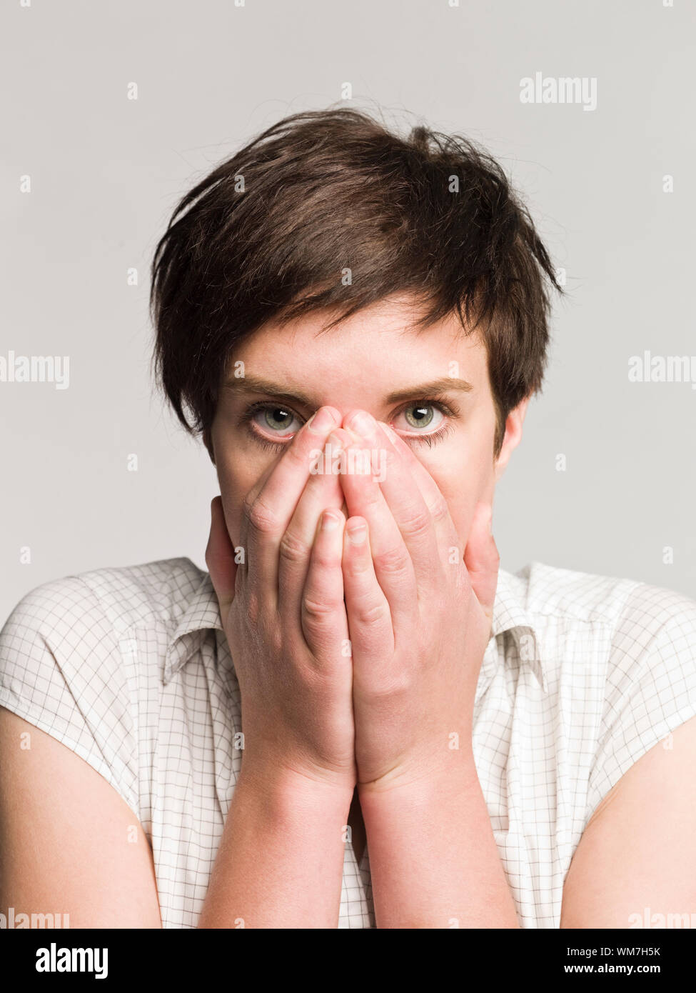 Portrait of an afraid woman Stock Photo - Alamy
