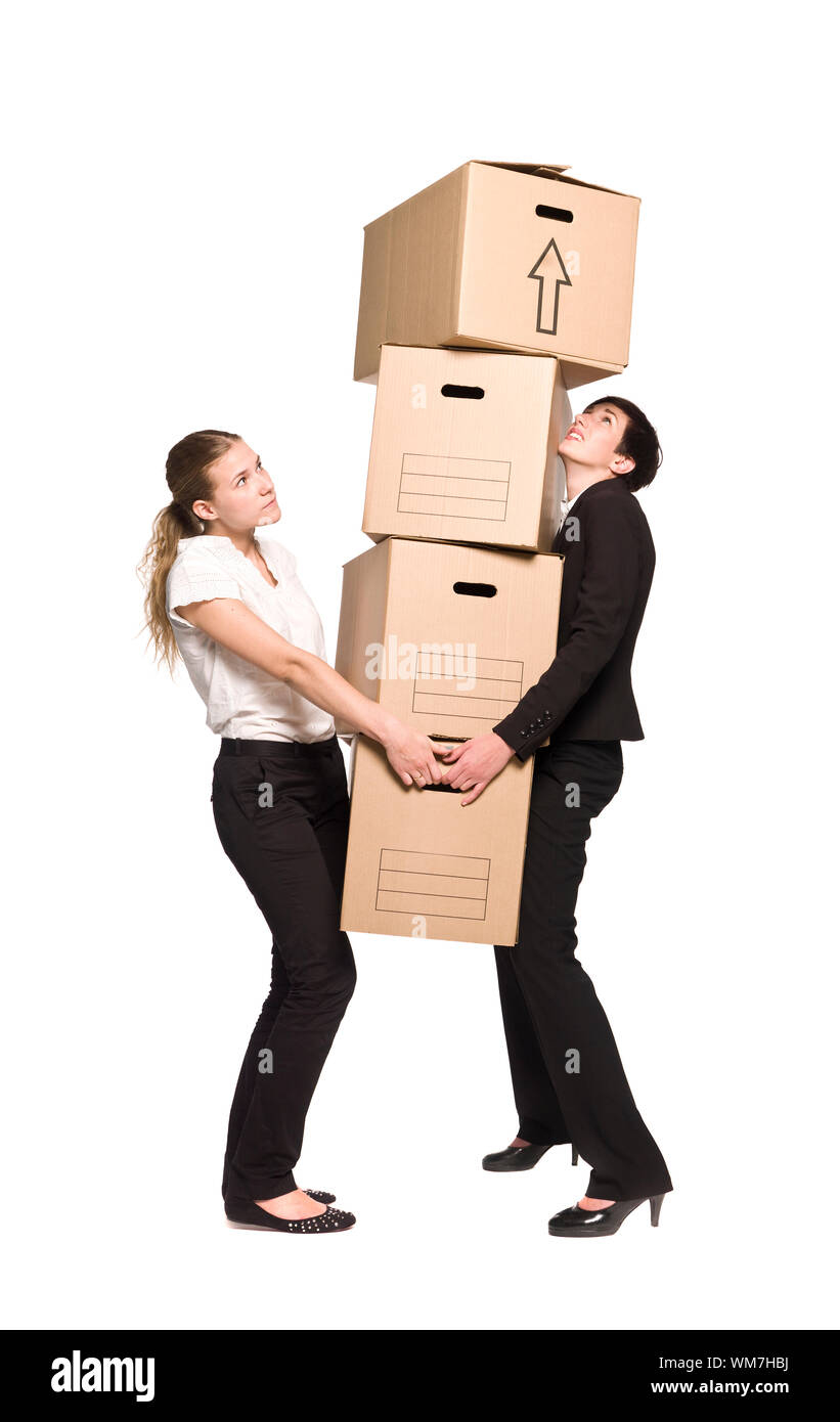 Two women carrying four boxes Stock Photo - Alamy