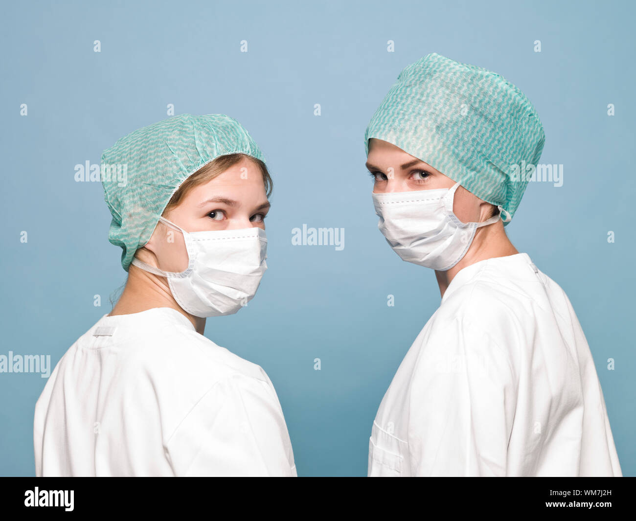 Two nurses with surgical masks Stock Photo - Alamy