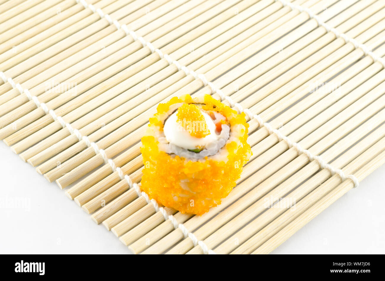 sushi on shusi mat over white background Stock Photo - Alamy