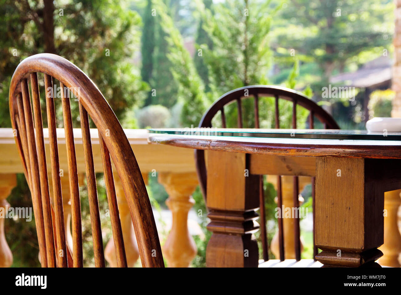 Old table and chair dining area Stock Photo - Alamy