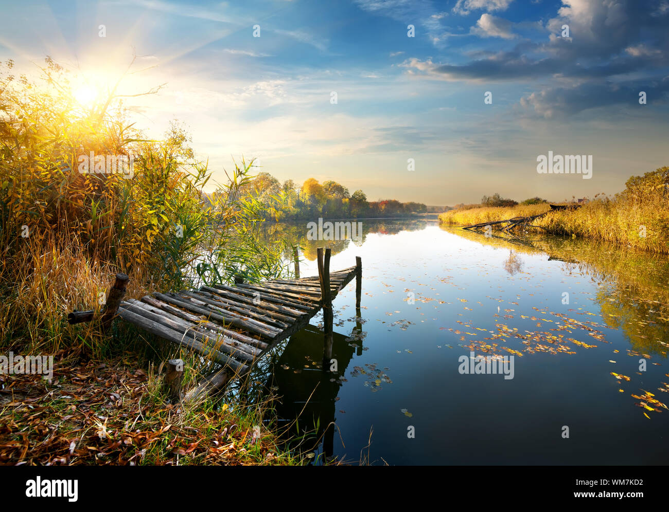 Old pier on autumn river at sunset Stock Photo - Alamy