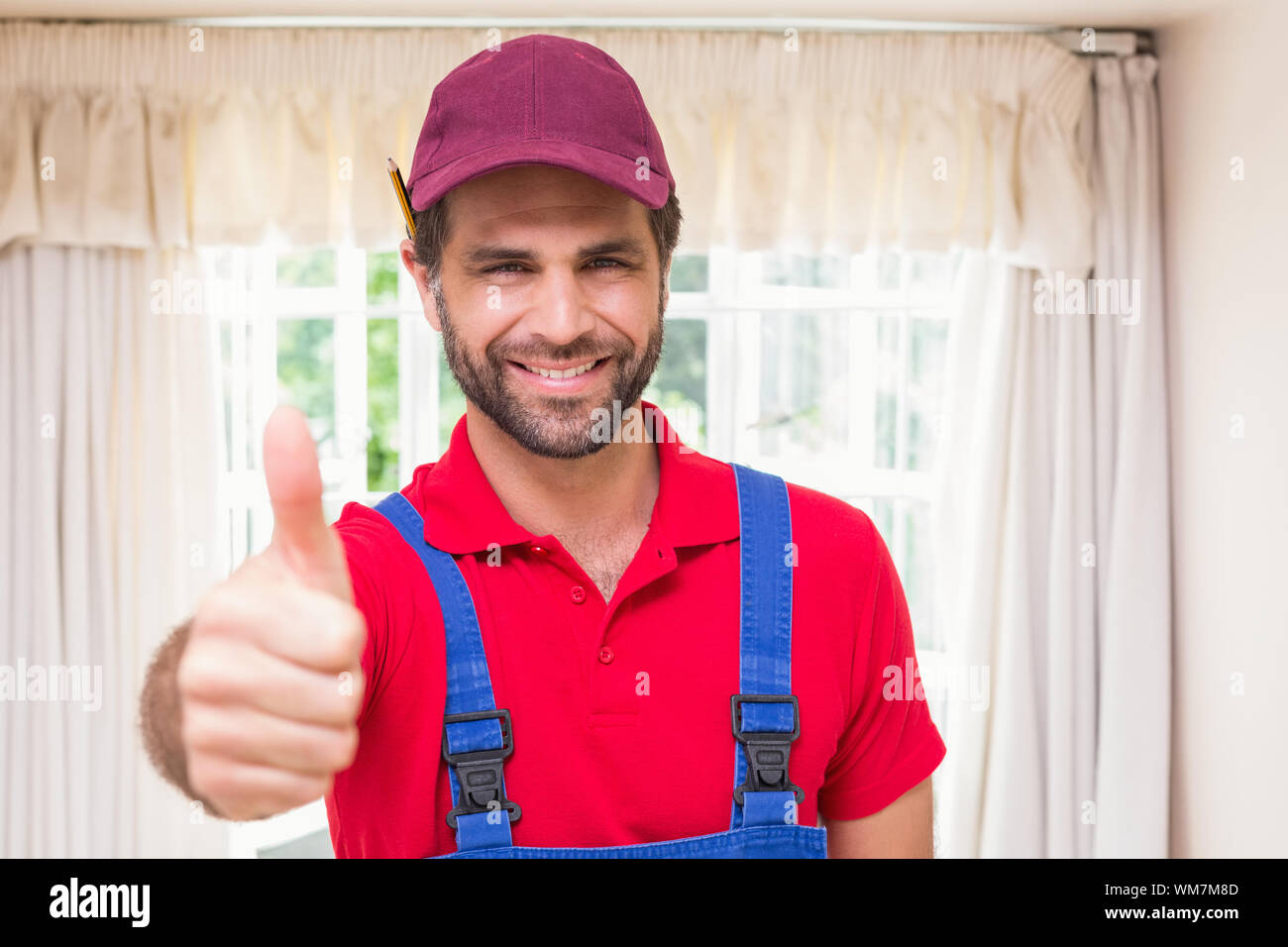 Construction worker showing thumbs up hi-res stock photography and ...