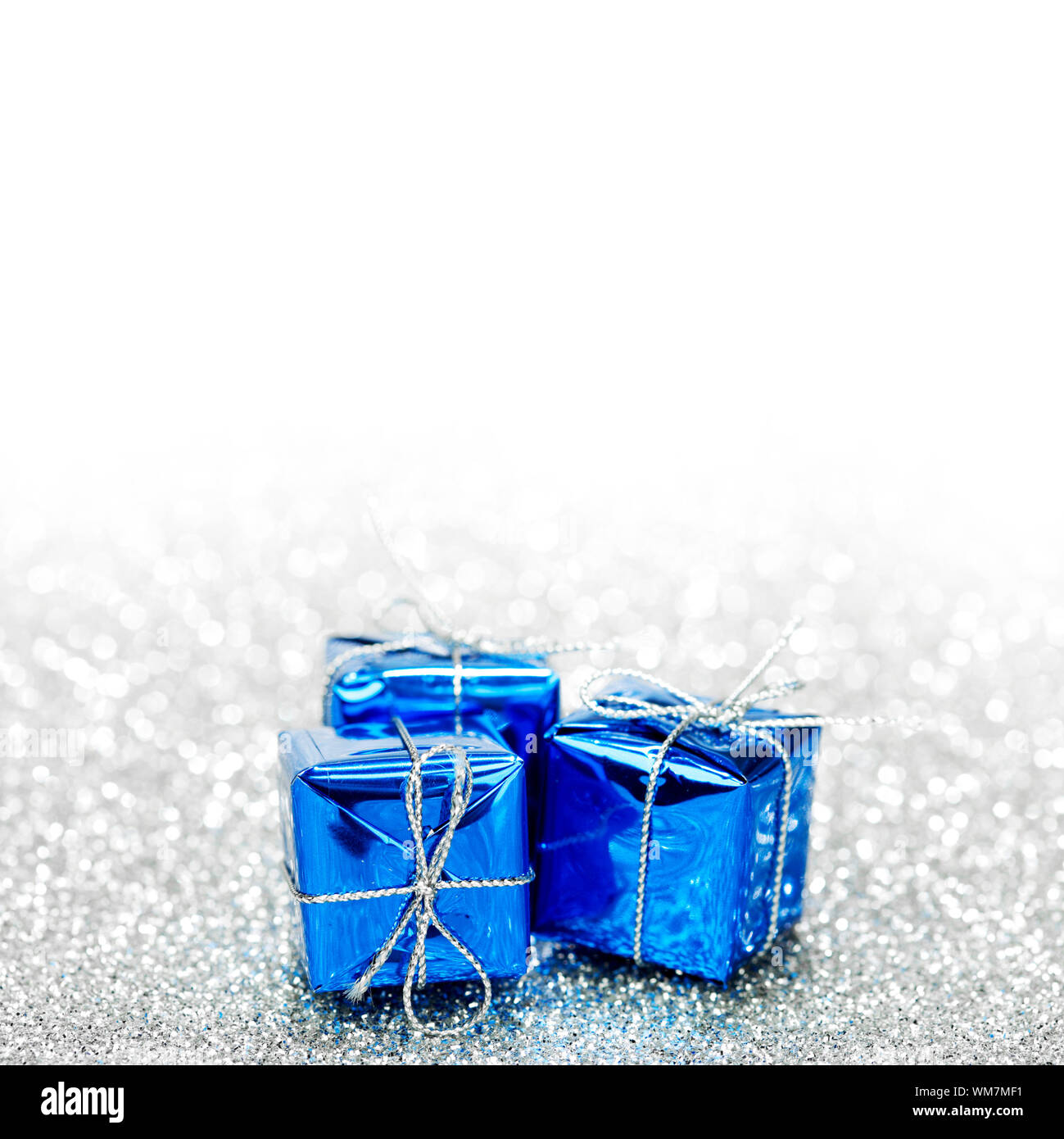 Decorative blue holiday gift boxes on bright shiny background Stock ...