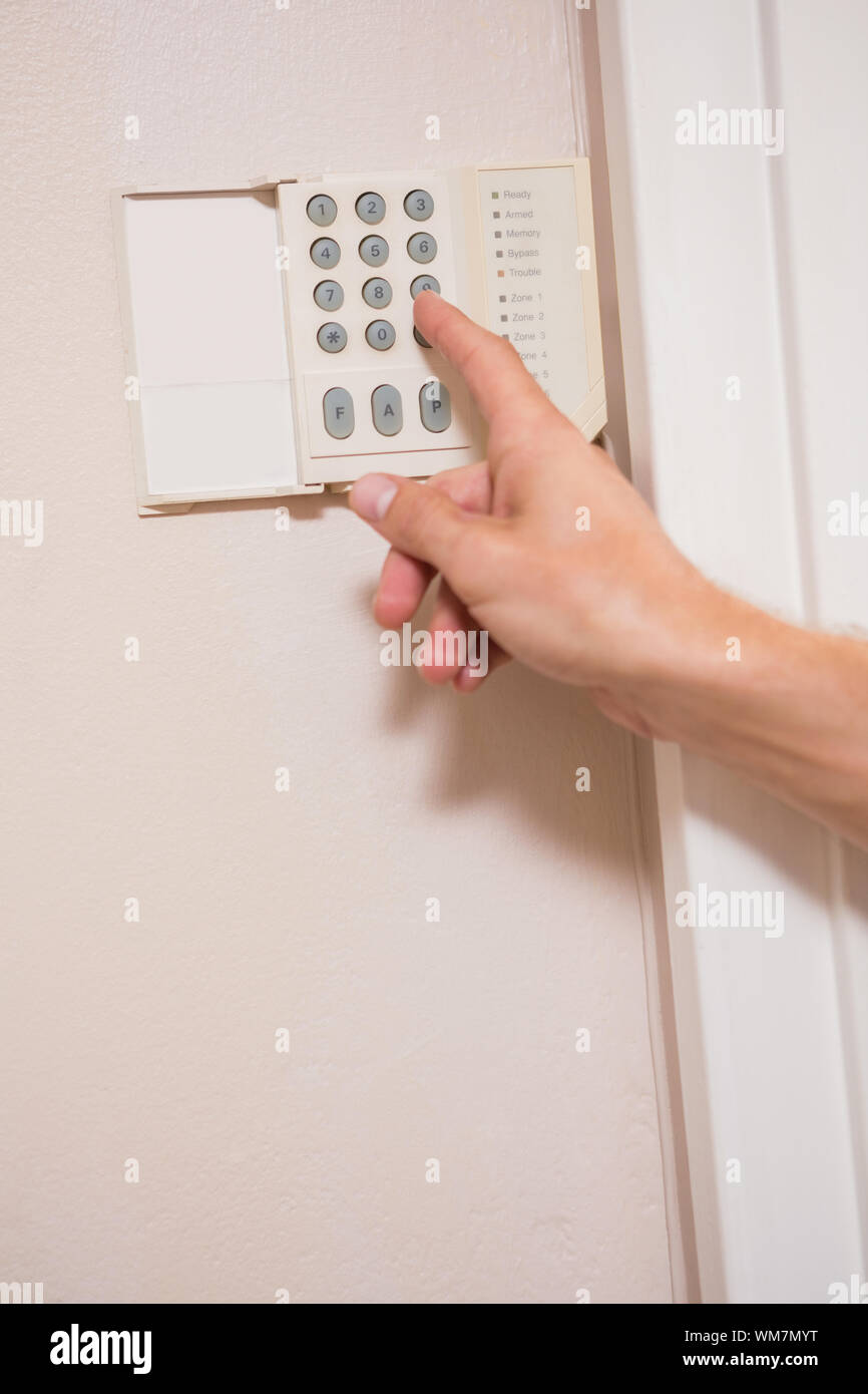 Close up of finger and security on the wall Stock Photo - Alamy