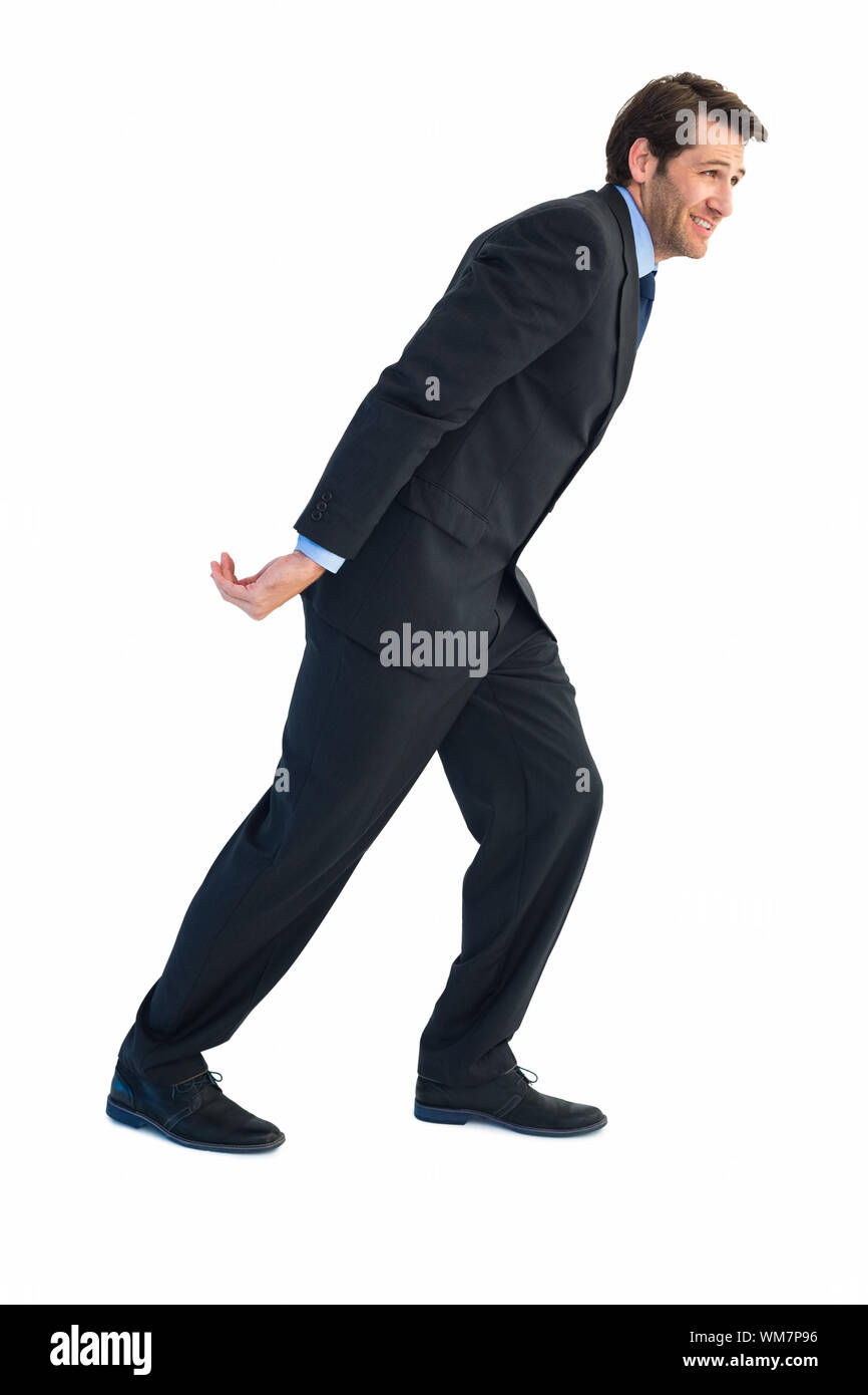 Businessman pulling something behind him on white background Stock ...