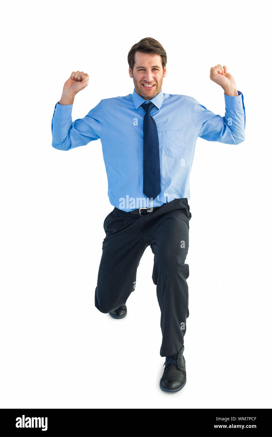 Focused businessman lifting up something heavy on white background ...