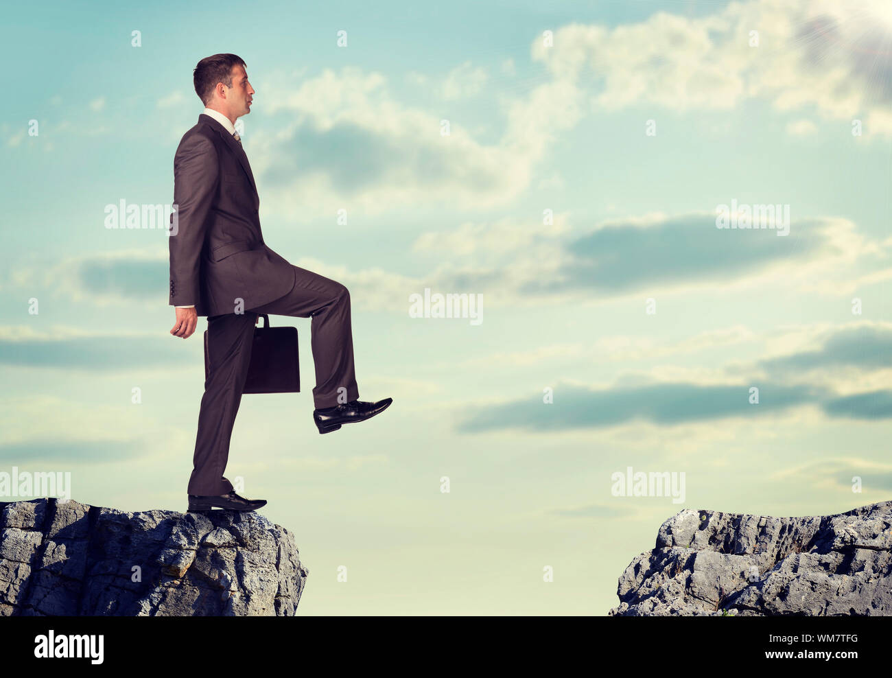 Businessman lifting rock hi-res stock photography and images - Alamy