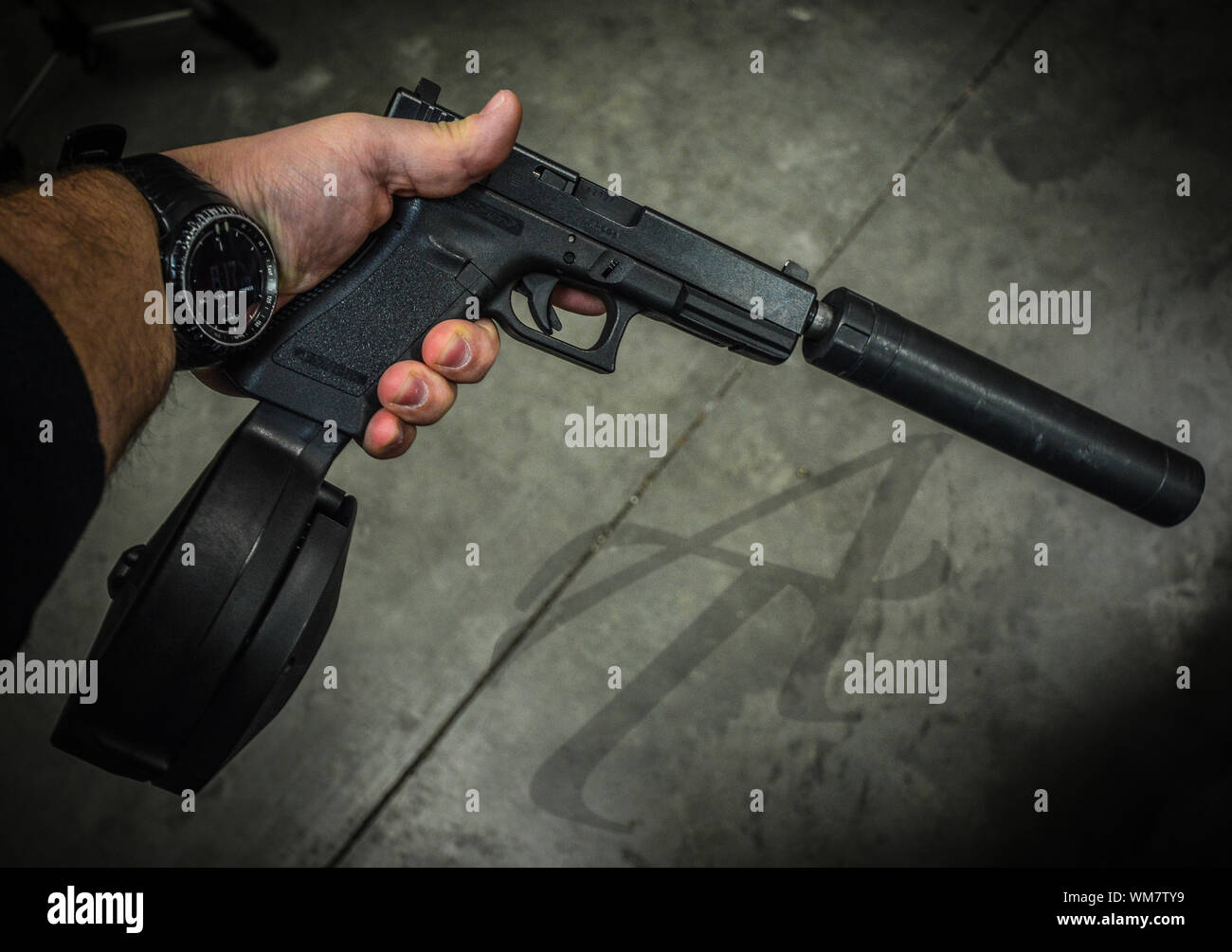 Holding hand gun hi-res stock photography and images - Alamy