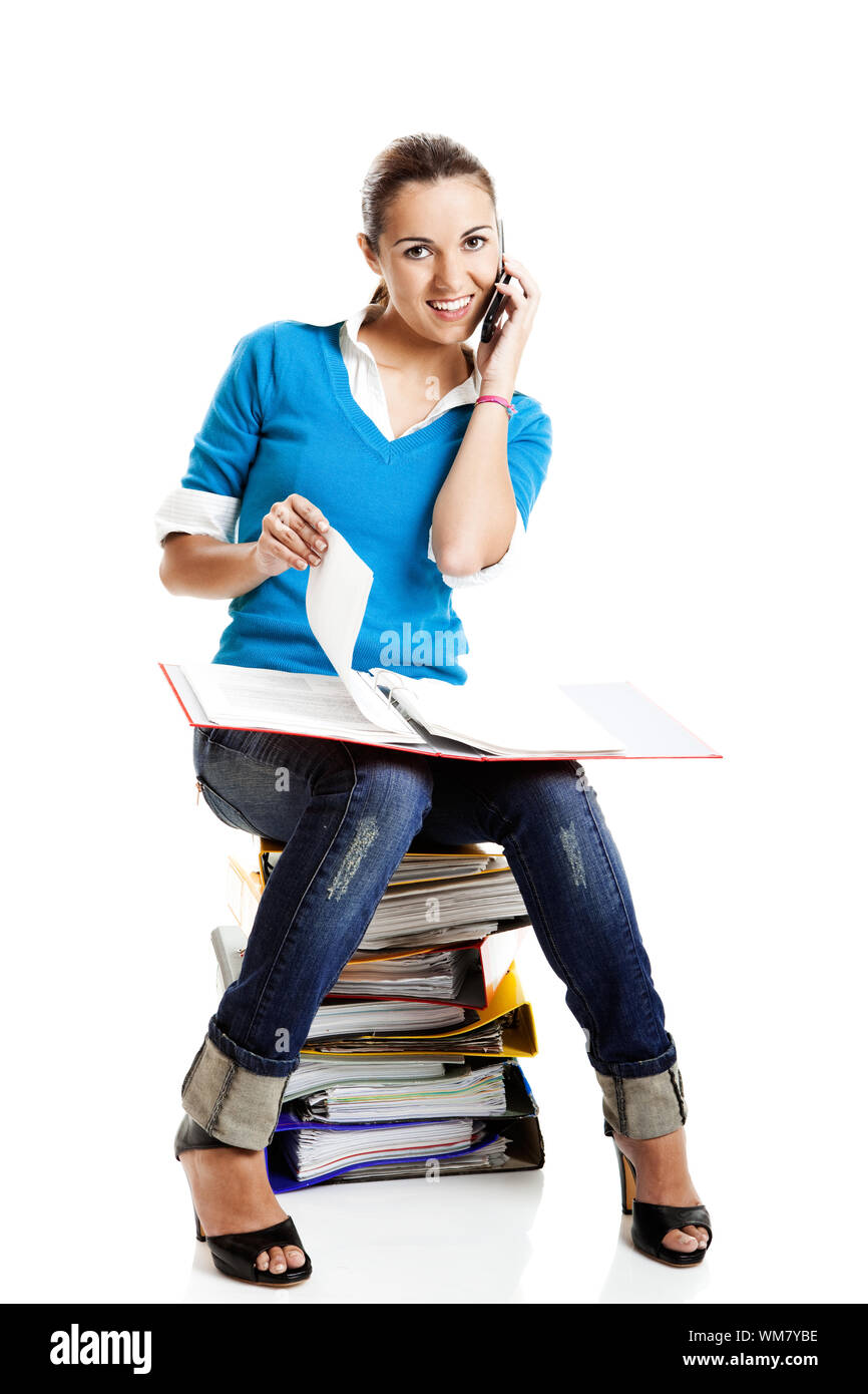 Beautiful female student making a phone call isolated on white Stock ...