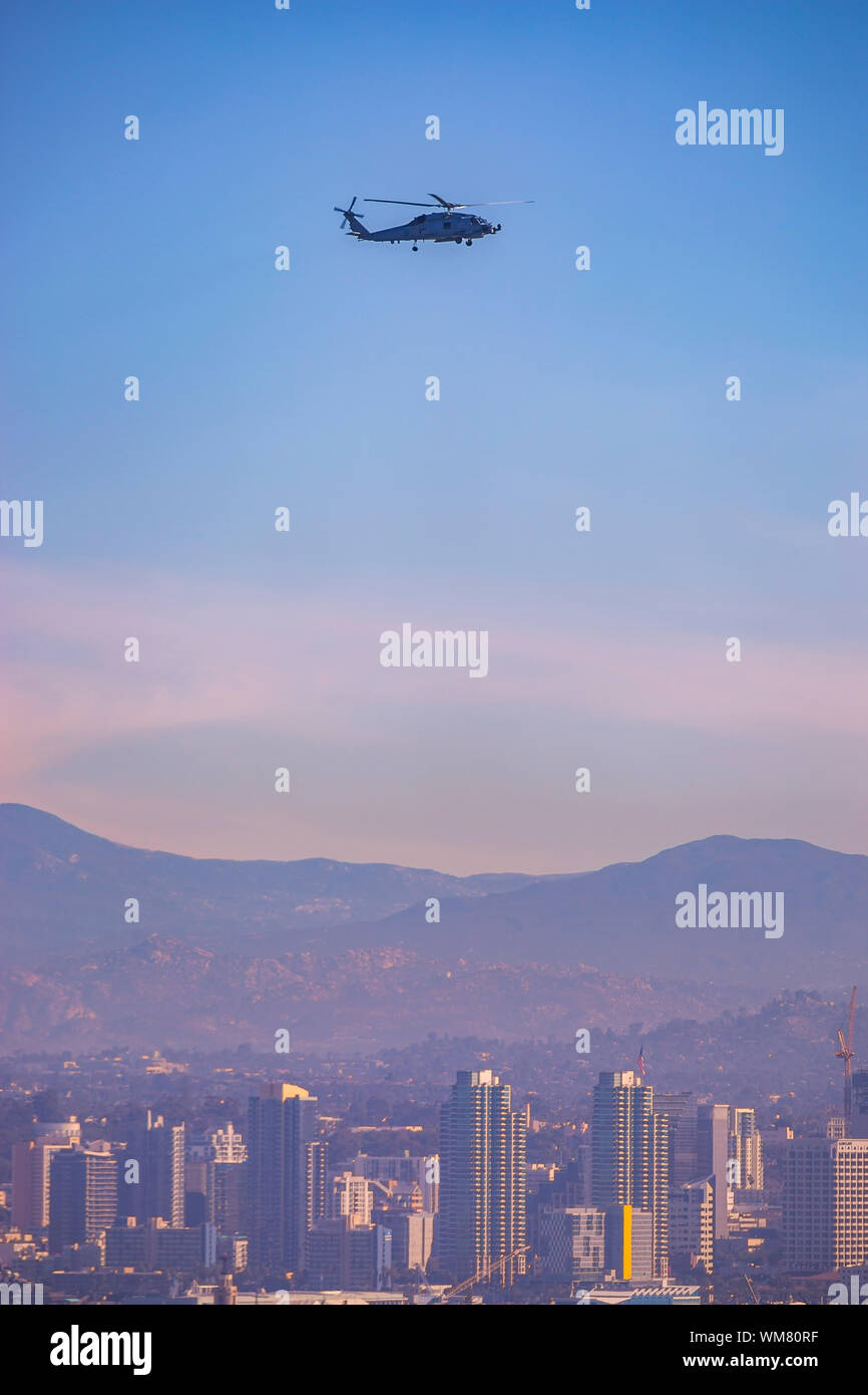 Helicopter flying over mountains hi-res stock photography and images ...