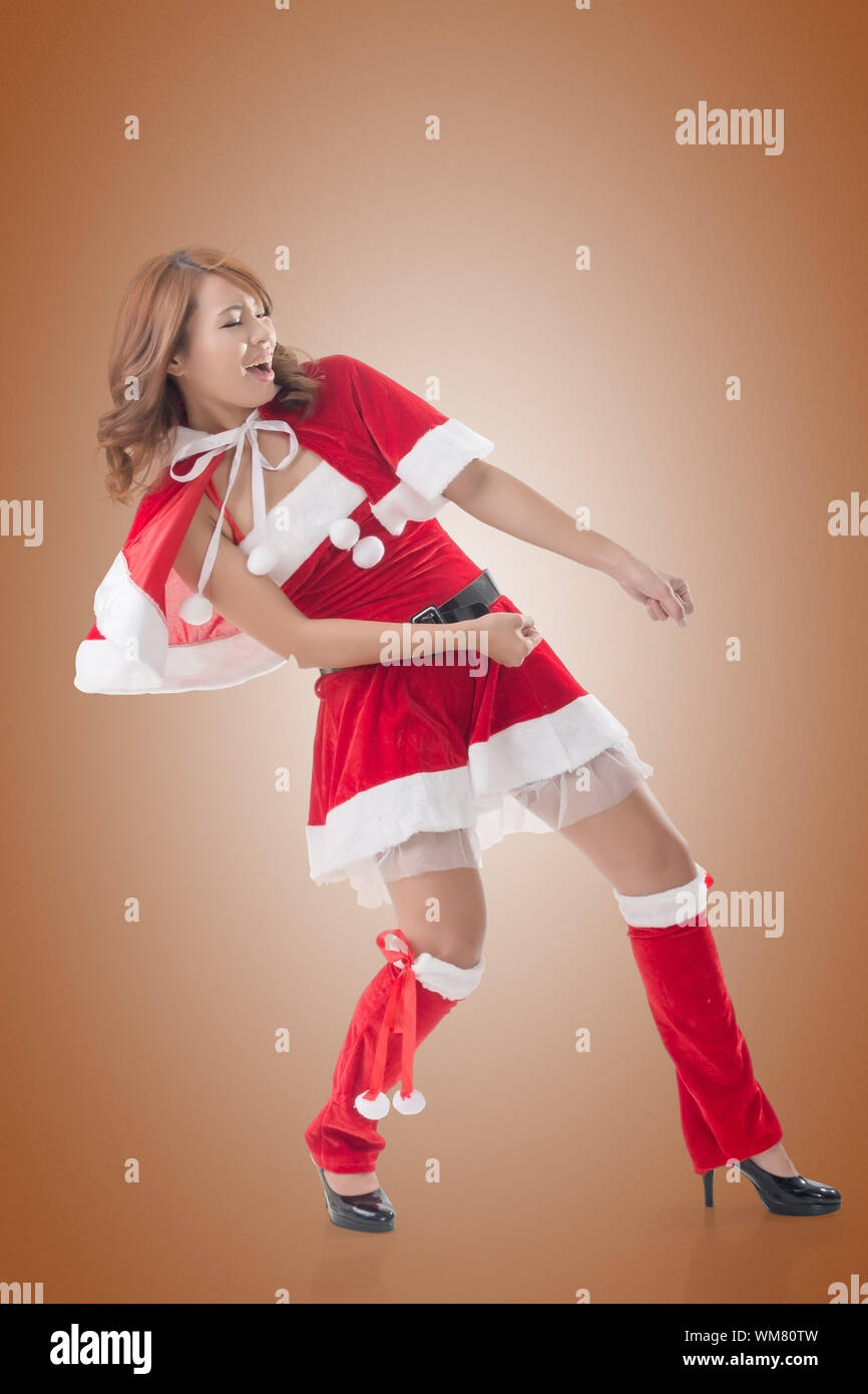 Christmas girl pull something, full length portrait Stock Photo - Alamy