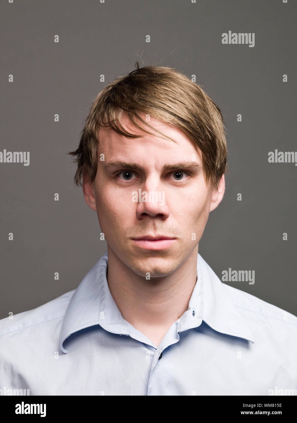 Portrait of a serious man Stock Photo - Alamy