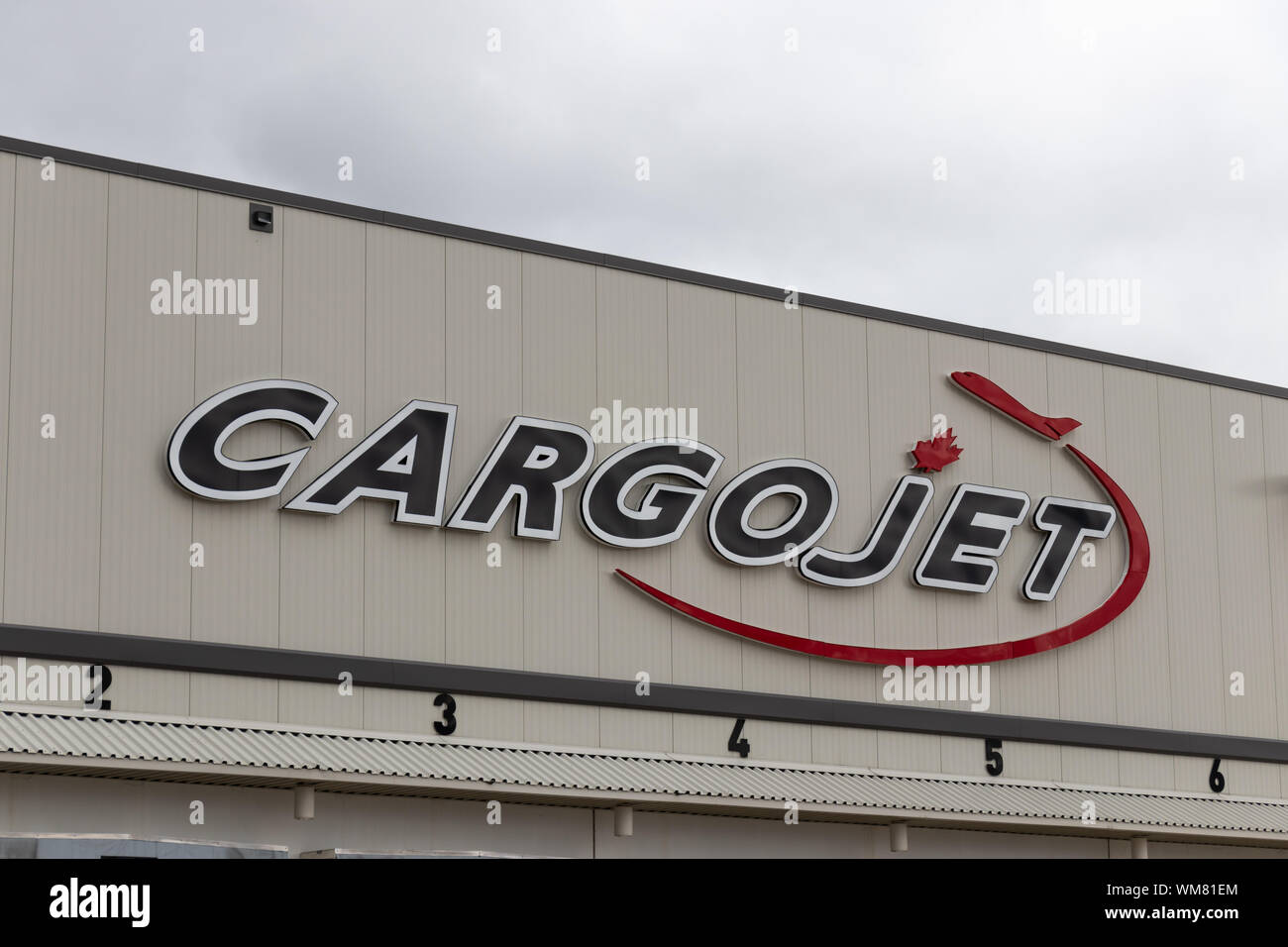 CargoJet logo on the side of a warehouse at their base at Hamilton Intl ...