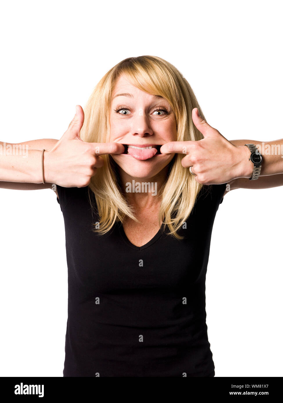 Blond woman making a grimace Stock Photo - Alamy