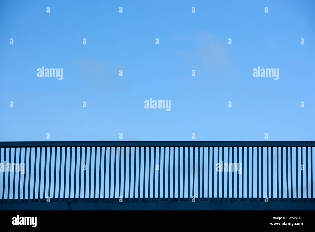 Railing of bridge towards blue sky Stock Photo - Alamy