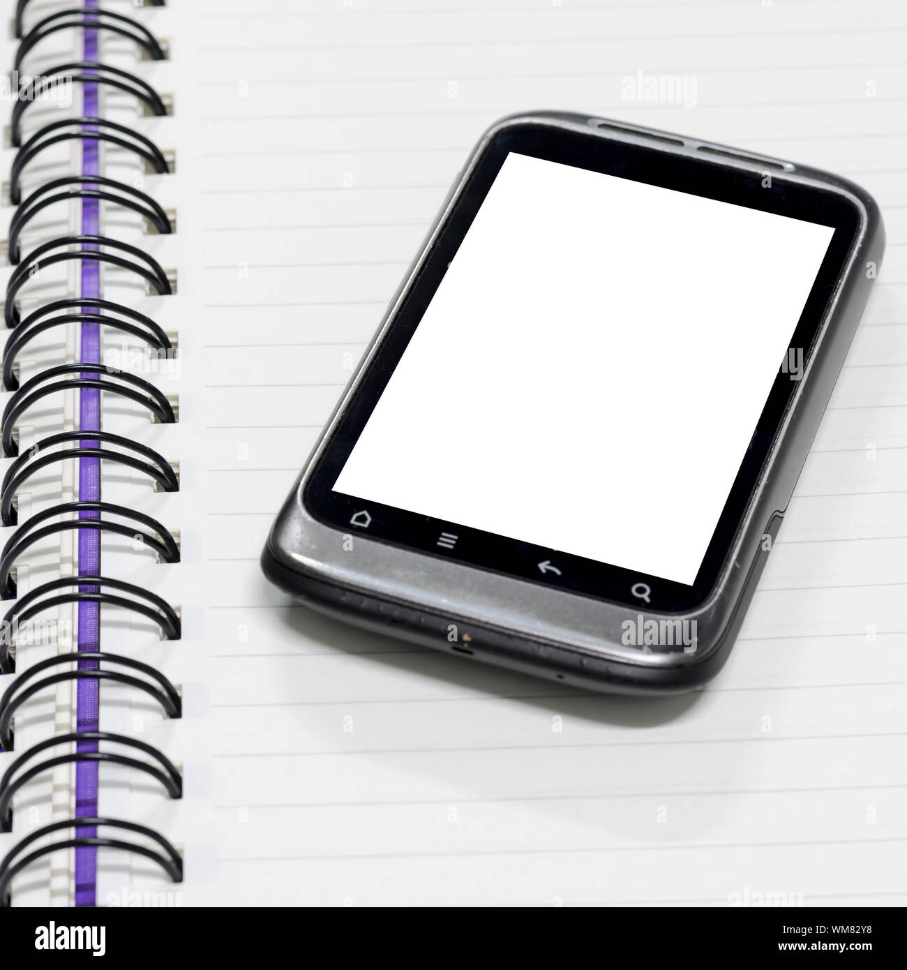 used smartphone with note book Stock Photo - Alamy