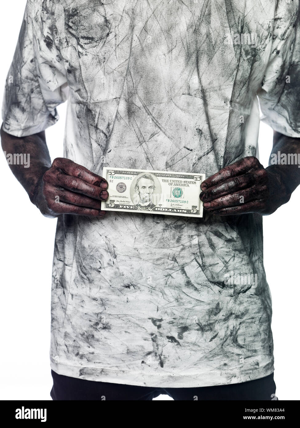 Very dirty person holding a five dollar bank note Stock Photo - Alamy