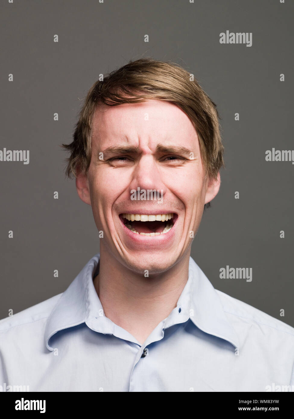 Portrait of a man in pain Stock Photo - Alamy