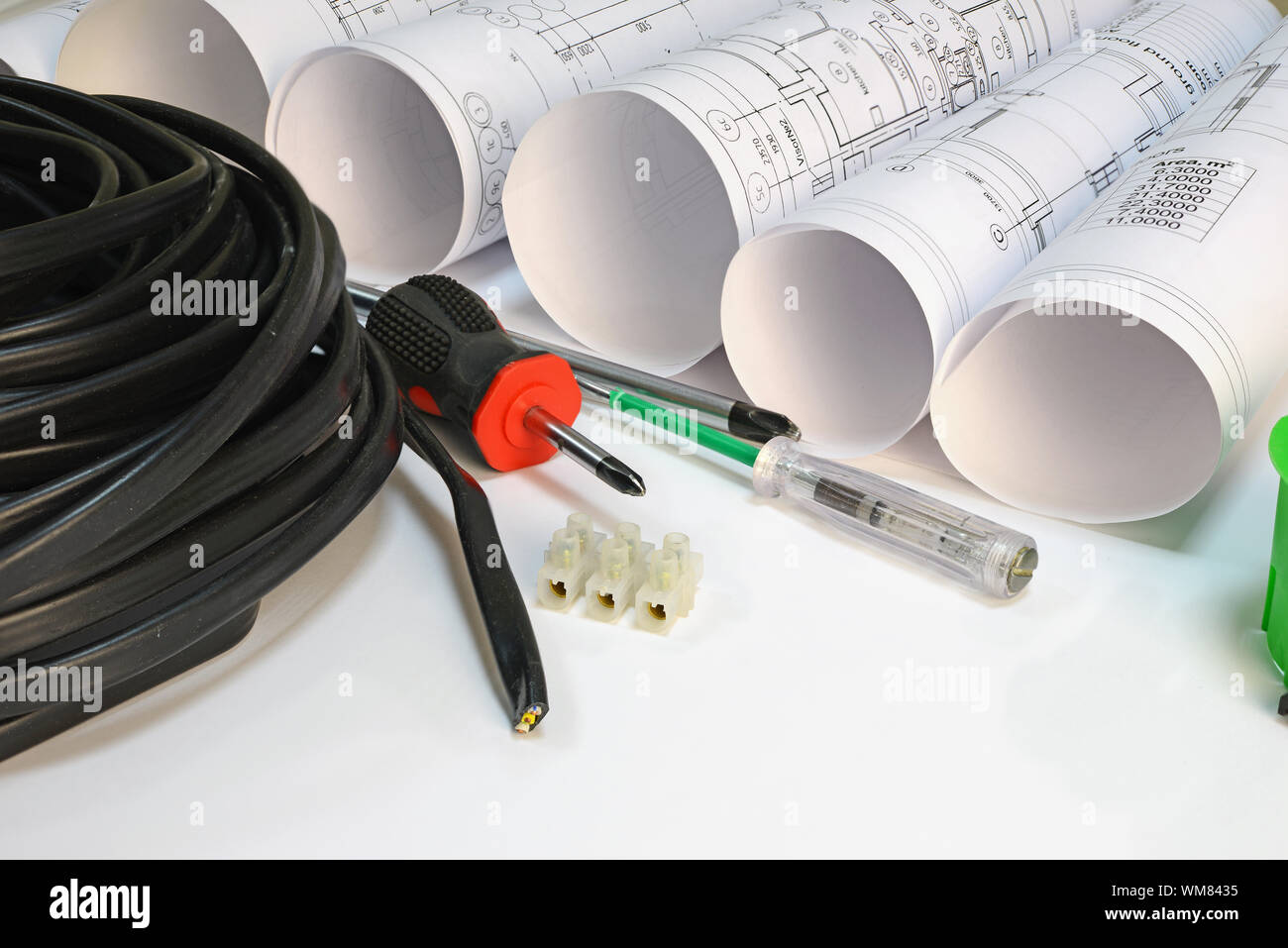 Drawing rolls, triple cable, screwdrivers, test pen, terminal block on ...