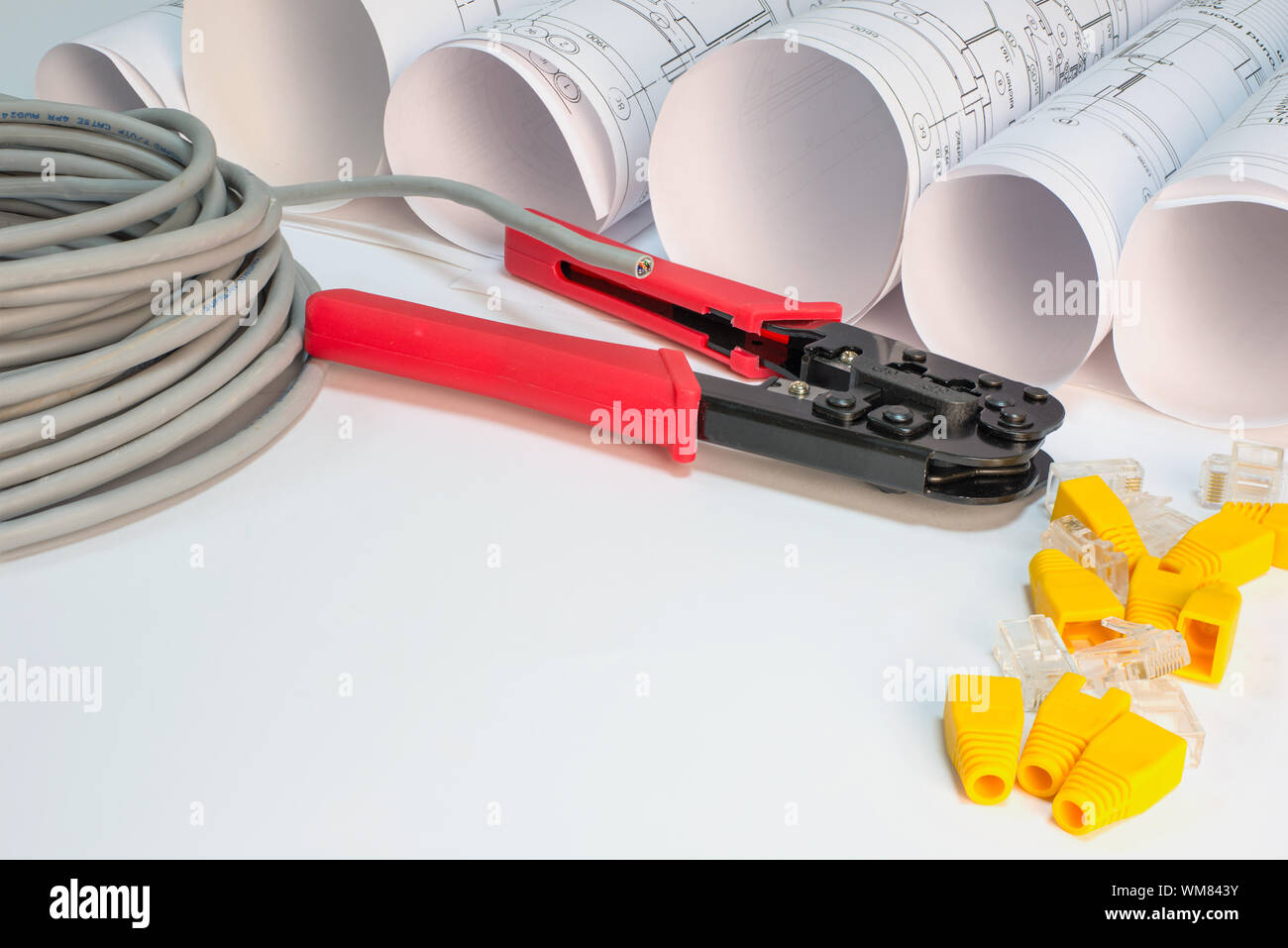 Drawing rolls, cat 5 cable, crimping pliers, connectors and boot caps ...