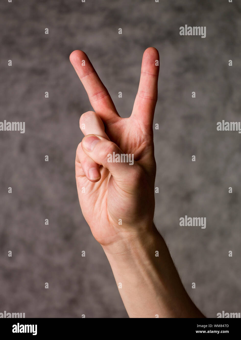 Hand making a peace sign Stock Photo - Alamy