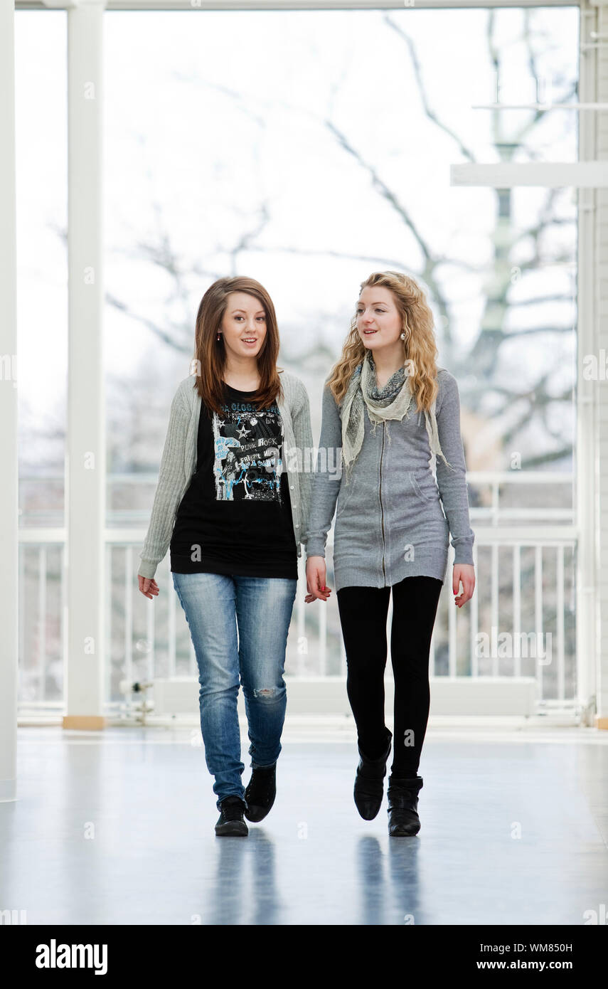 two girls walking Stock Photo - Alamy