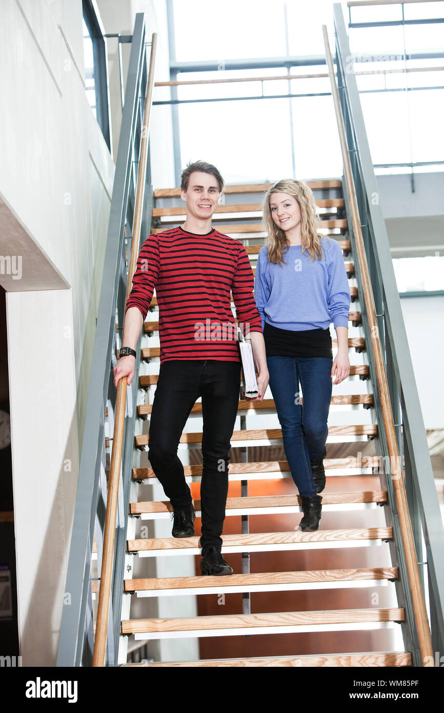 Couple walk the stairs Stock Photo - Alamy