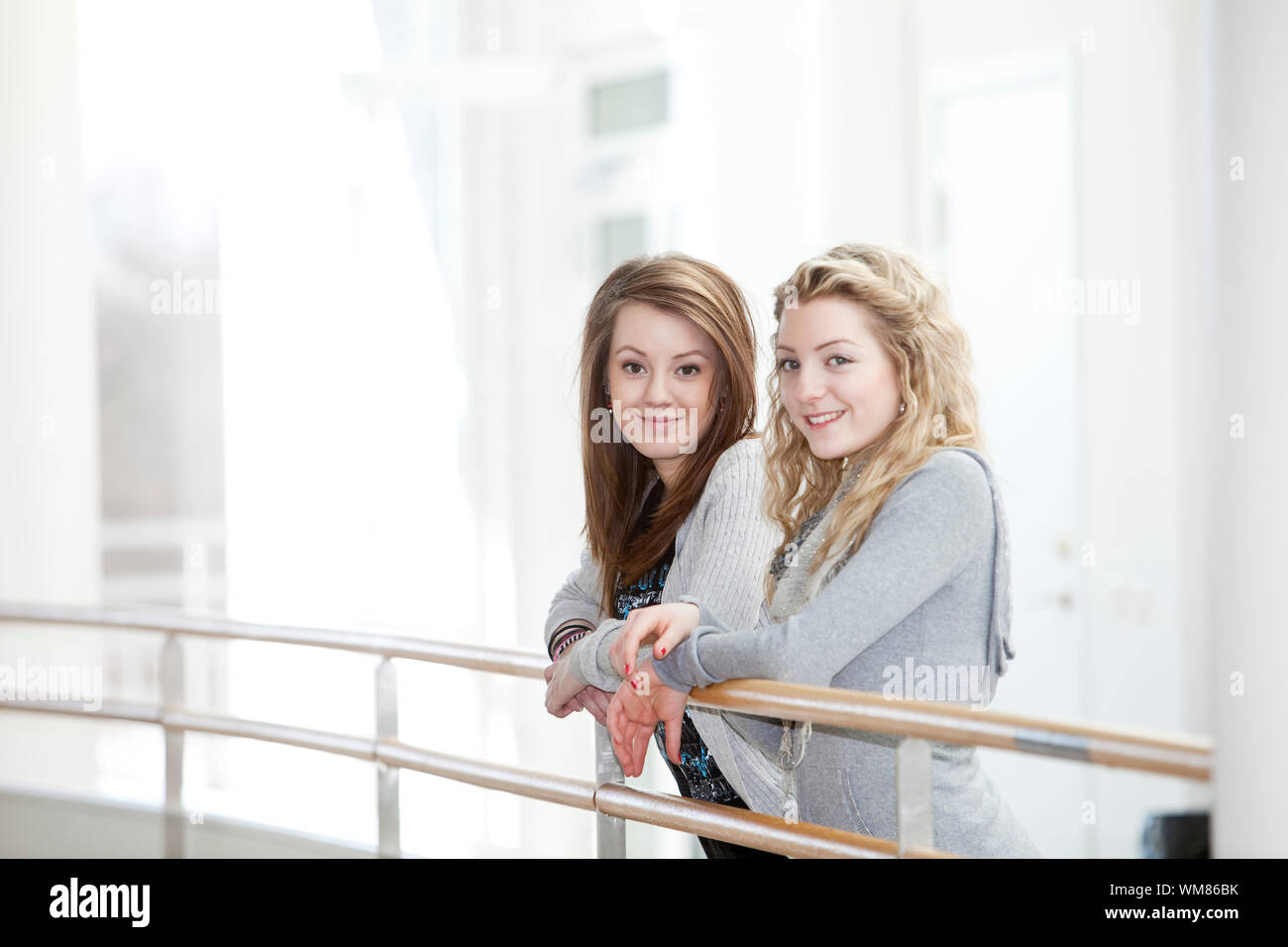 two girls smiling Stock Photo - Alamy