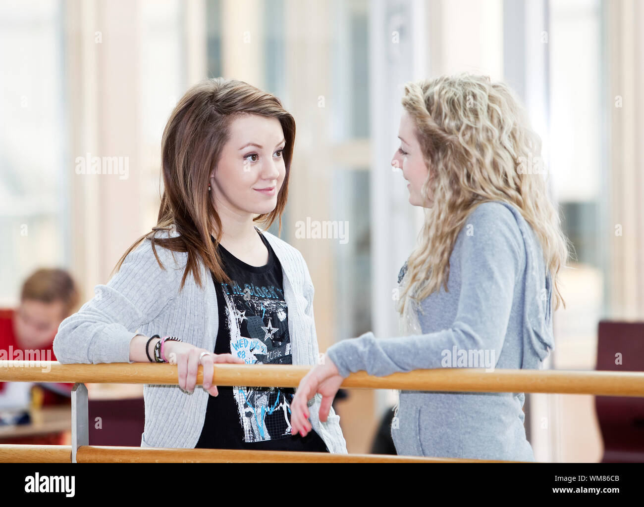 two girls in a conversation Stock Photo - Alamy