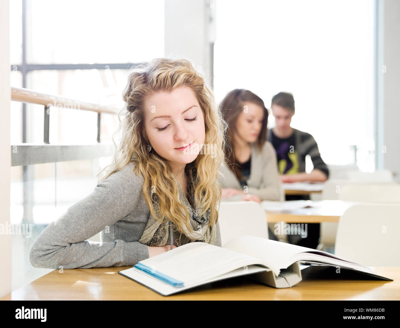 People in a row Stock Photo - Alamy